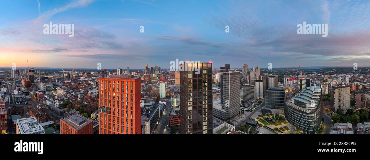 Aerial view of modern high-rises with sunrise reflected on glass ...