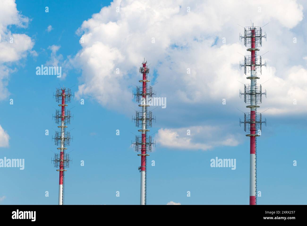 Red and white radar towers near the airport. signal towers Stock Photo ...