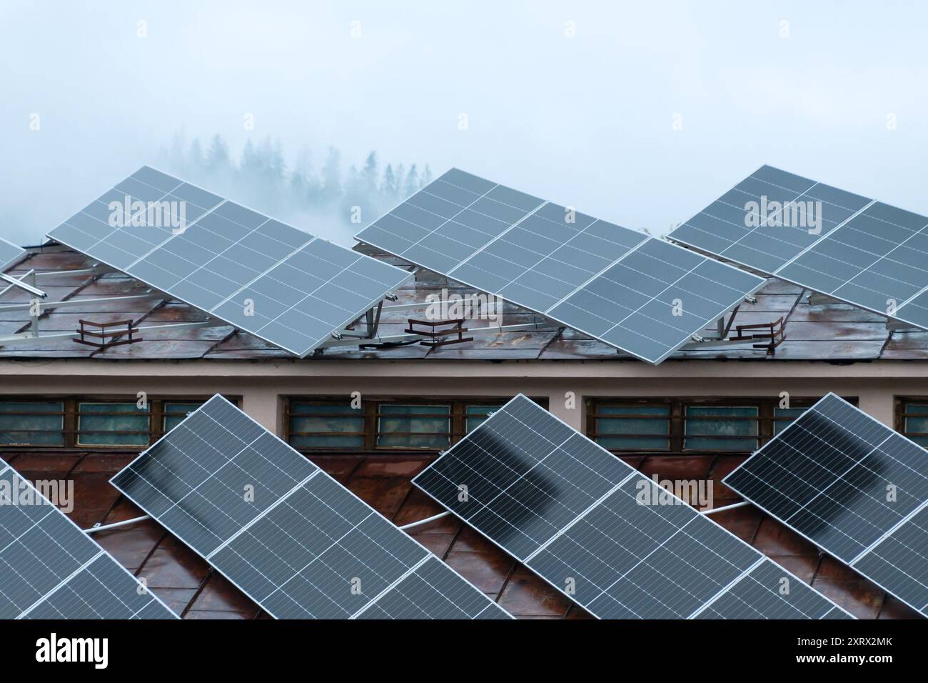 Solar panels on a building in bad weather. Cloudy, foggy, rainy weather ...