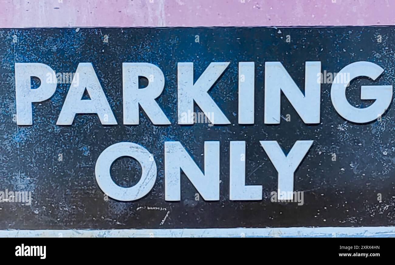 Parking Only Signage: White Letters on Black Board Stock Photo - Alamy