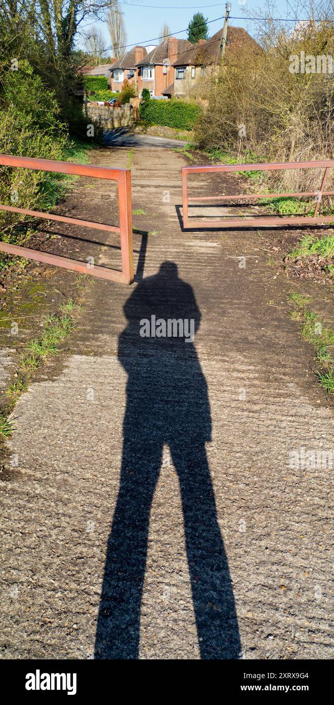 My elongates shadow and an open footpath gate greets me on one of my ...