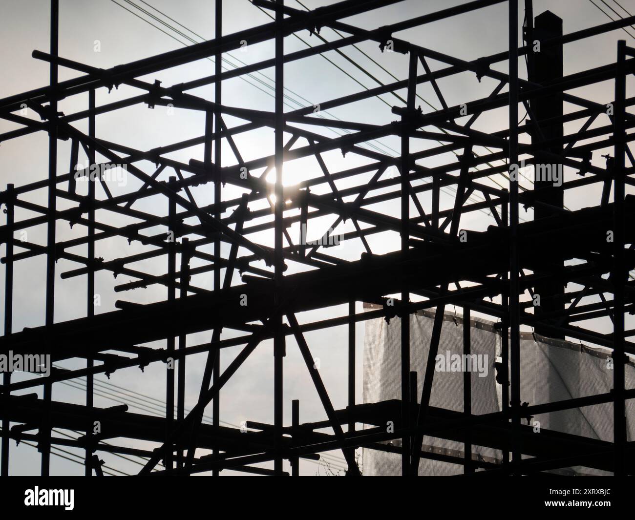 Scaffolding and tarpaulins - at a construction site for a new factory ...