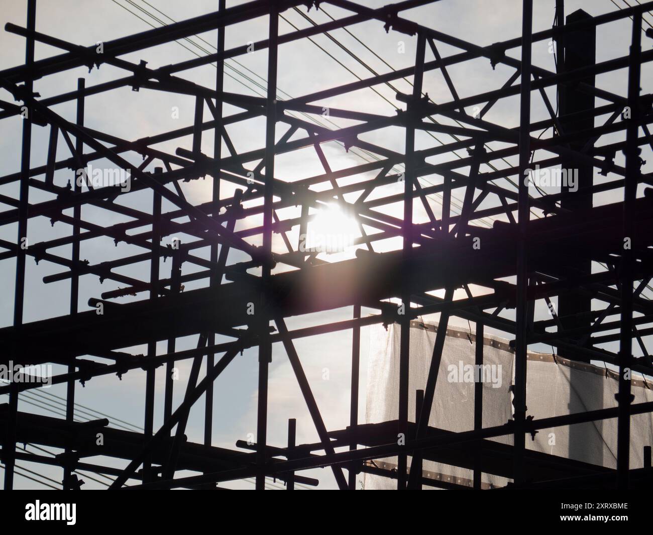 Scaffolding and tarpaulins - at a construction site for a new factory ...