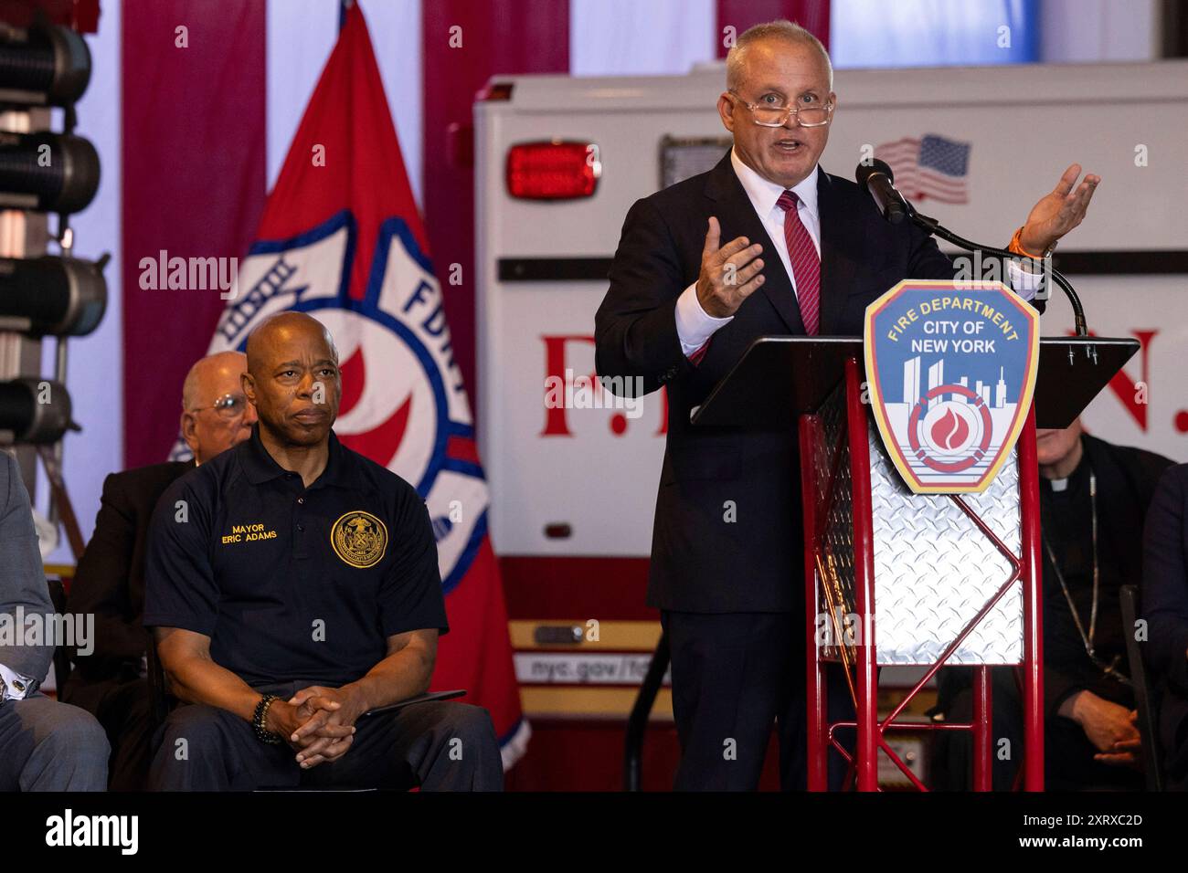 New York City Fire Commissioner Robert Tucker, right, speaks during a ...