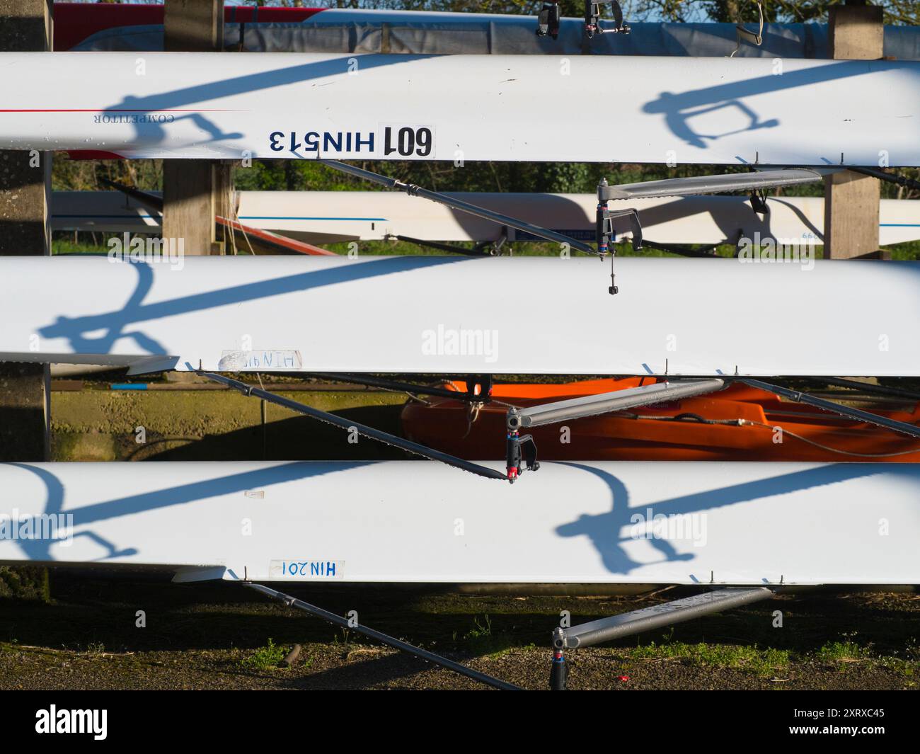 Racked sculls outside Radley boathouse by the Thames create these ...