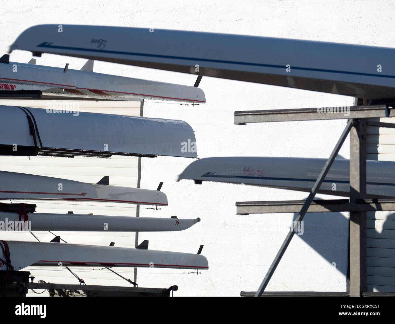 Racked sculls outside Radley boathouse by the Thames create these ...