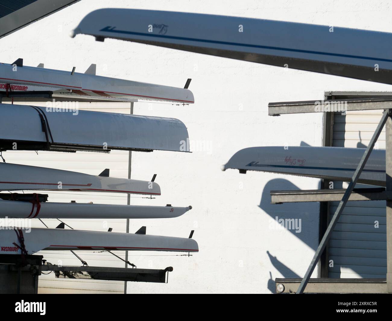 Racked sculls outside Radley boathouse by the Thames create these ...
