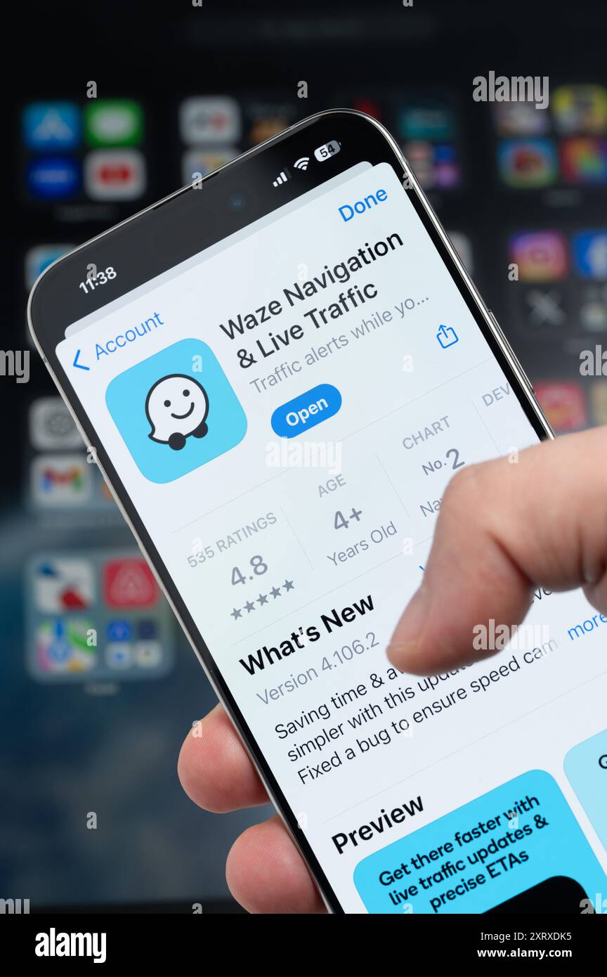 New York, USA - August 5, 2024: Smartphone in hand with Waze app on screen macro close up view ...