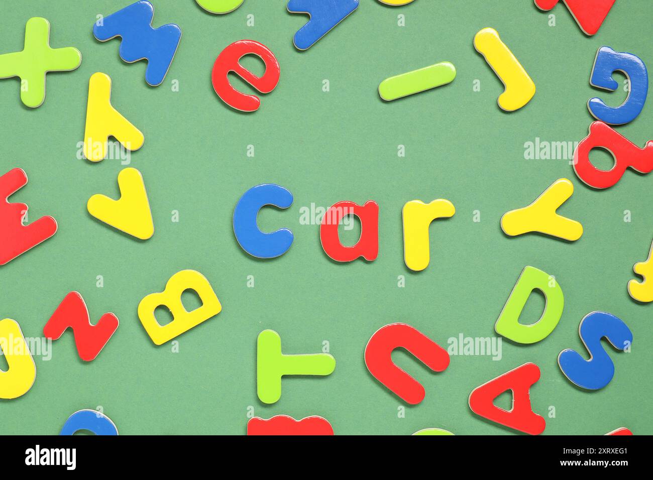 Word Car made of magnetic letters on green background, flat lay ...