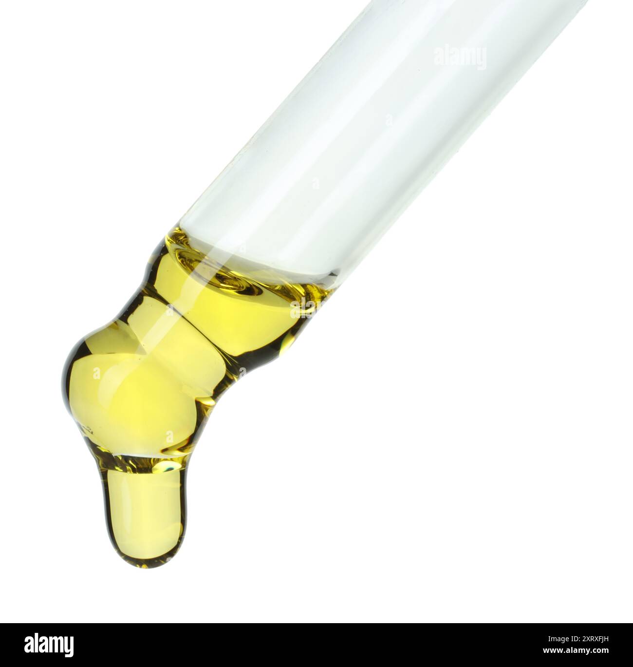 Dripping essential oil from pipette on white background Stock Photo - Alamy