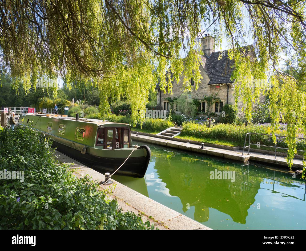 Houseboat between lock gates on the River Thames at Iffley, summer ...