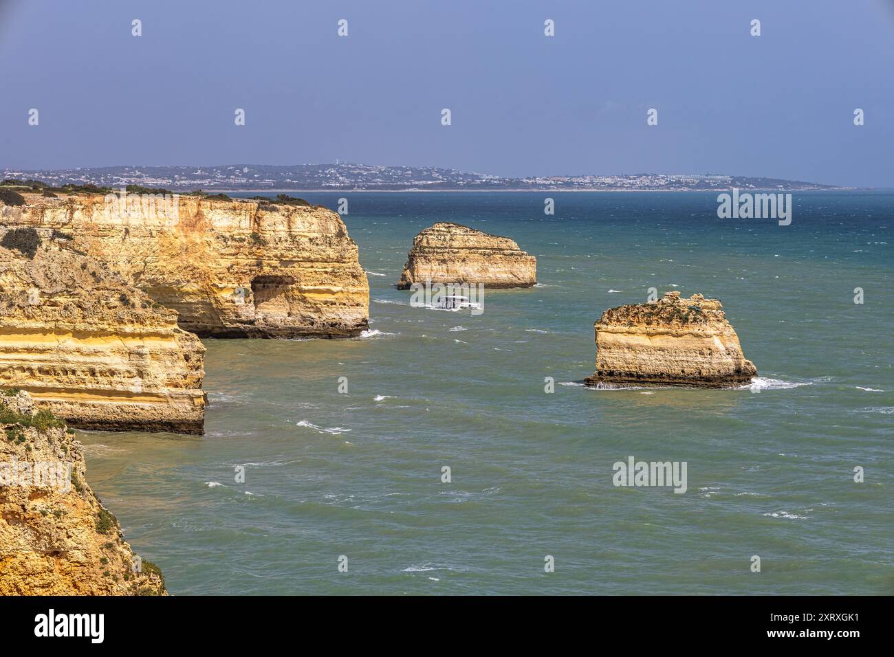 Praia da Marinha Beach among rock islets and cliffs seen from Seven ...