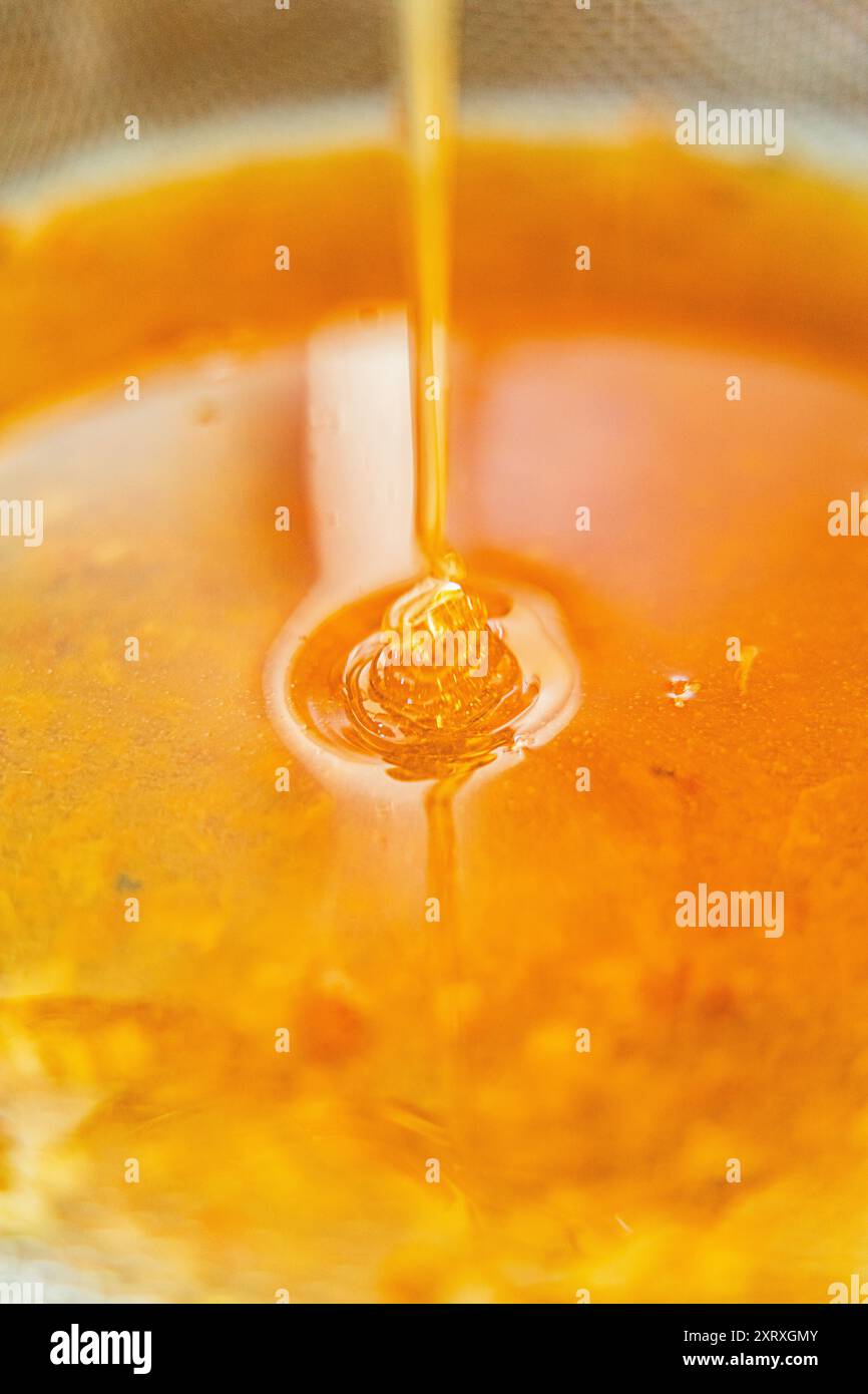 Golden honey drips from honeycombs hi-res stock photography and images ...