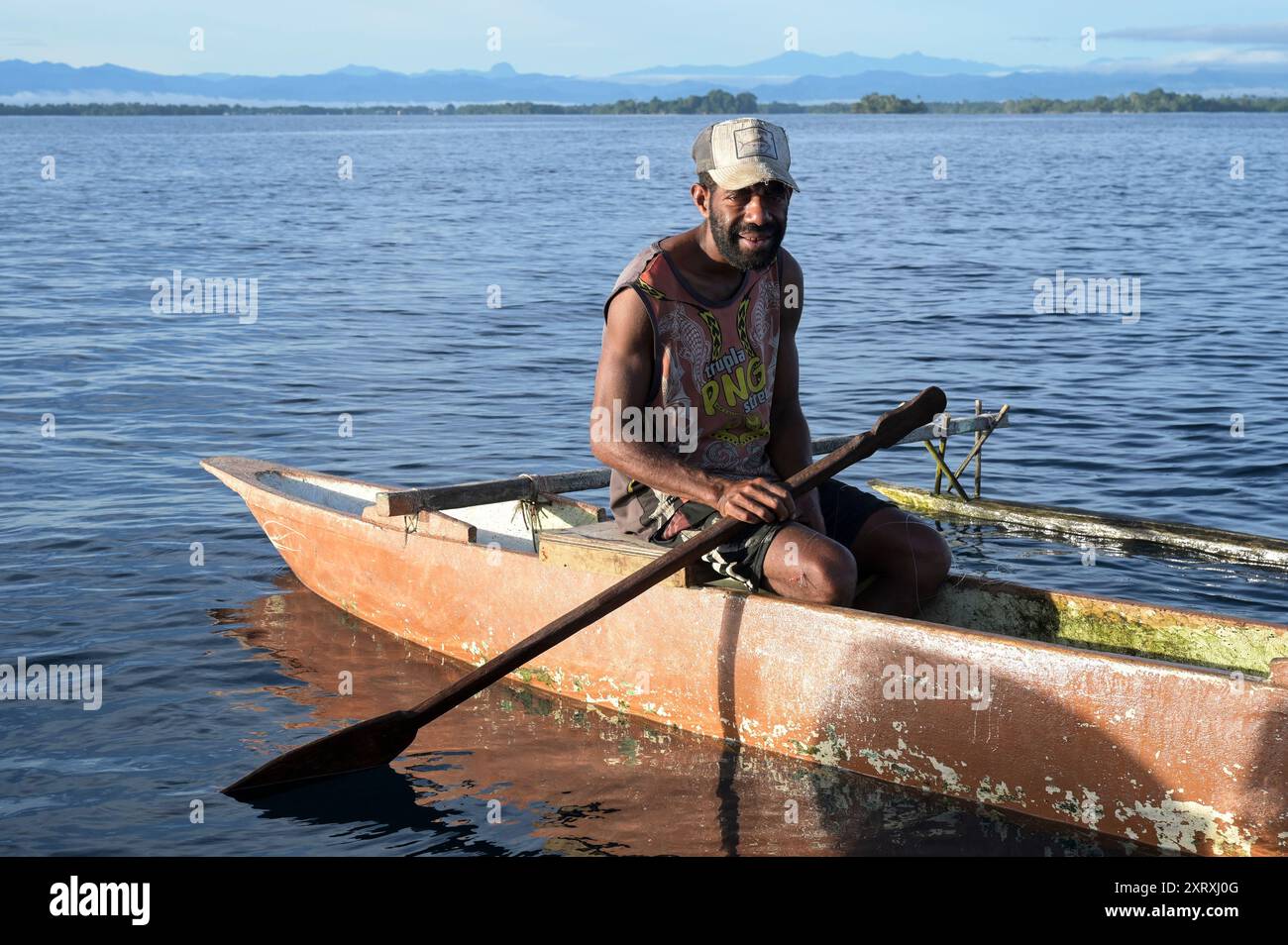 PAPUA NEW GUINEA, Madang, Bismarck Sea, small scale fisherman in Dinghy ...