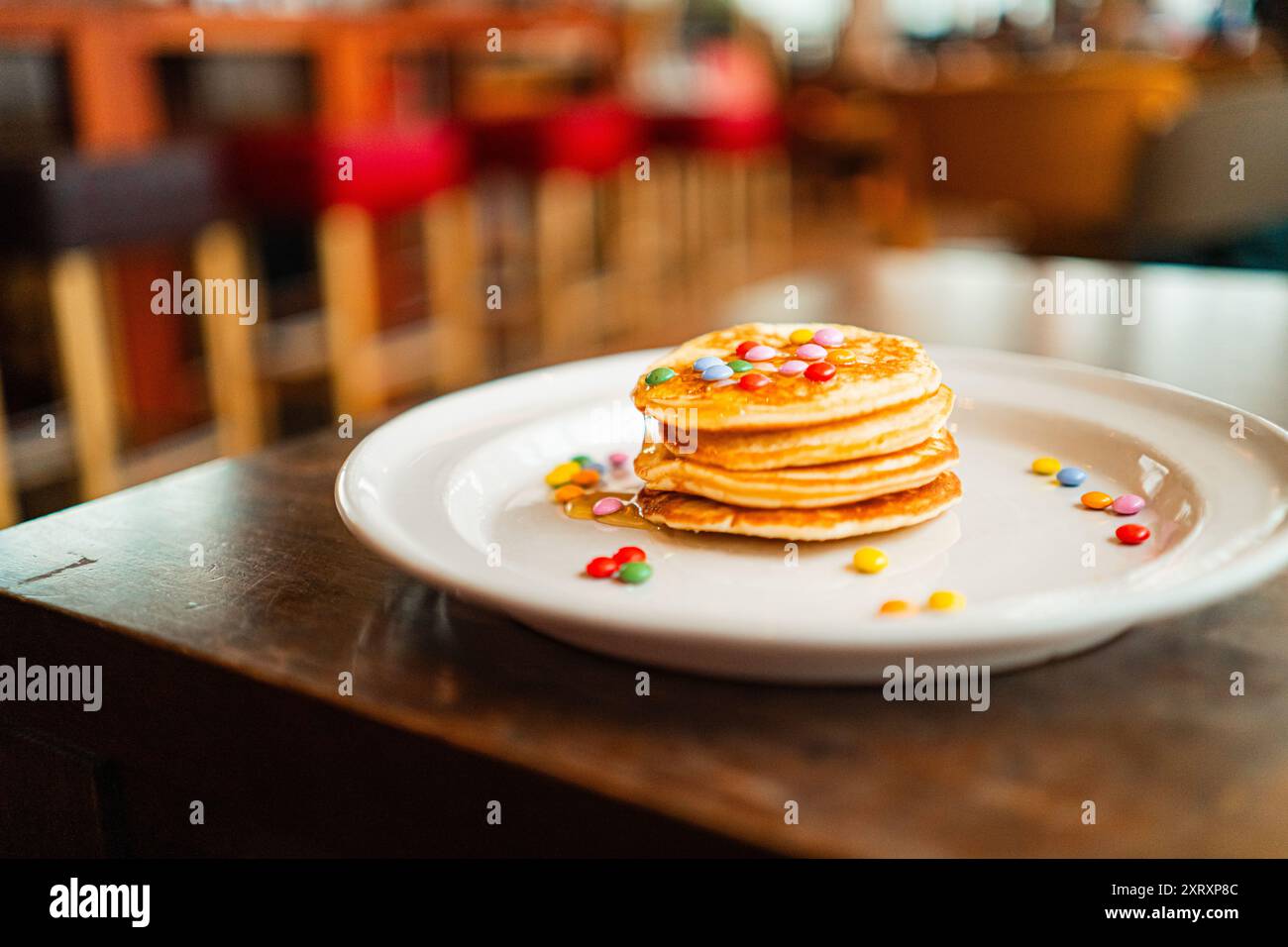 Colorful Chocolate Lentils Topping a Soft Stack of Pancakes Stock Photo ...