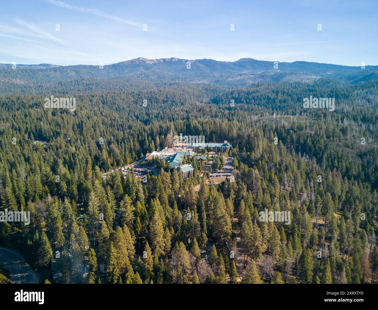 An aerial view of a large resort surrounded by a forest in Tenaya Lodge ...