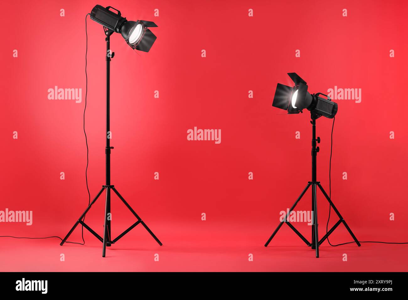 Red photo background and professional lighting equipment in studio ...