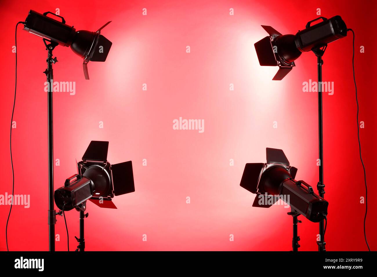 Red photo background and professional lighting equipment in studio ...