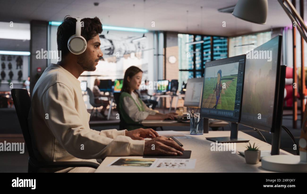 Indian Male Game Designer Using Desktop Computer With 3d Modelling Software To Design Unique