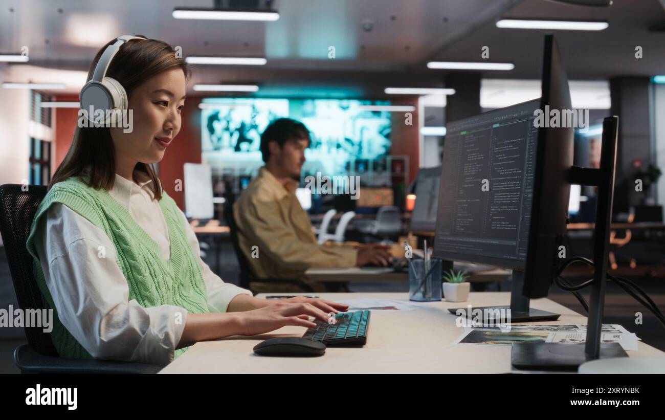 Female programmer writes code on hi-res stock photography and images ...