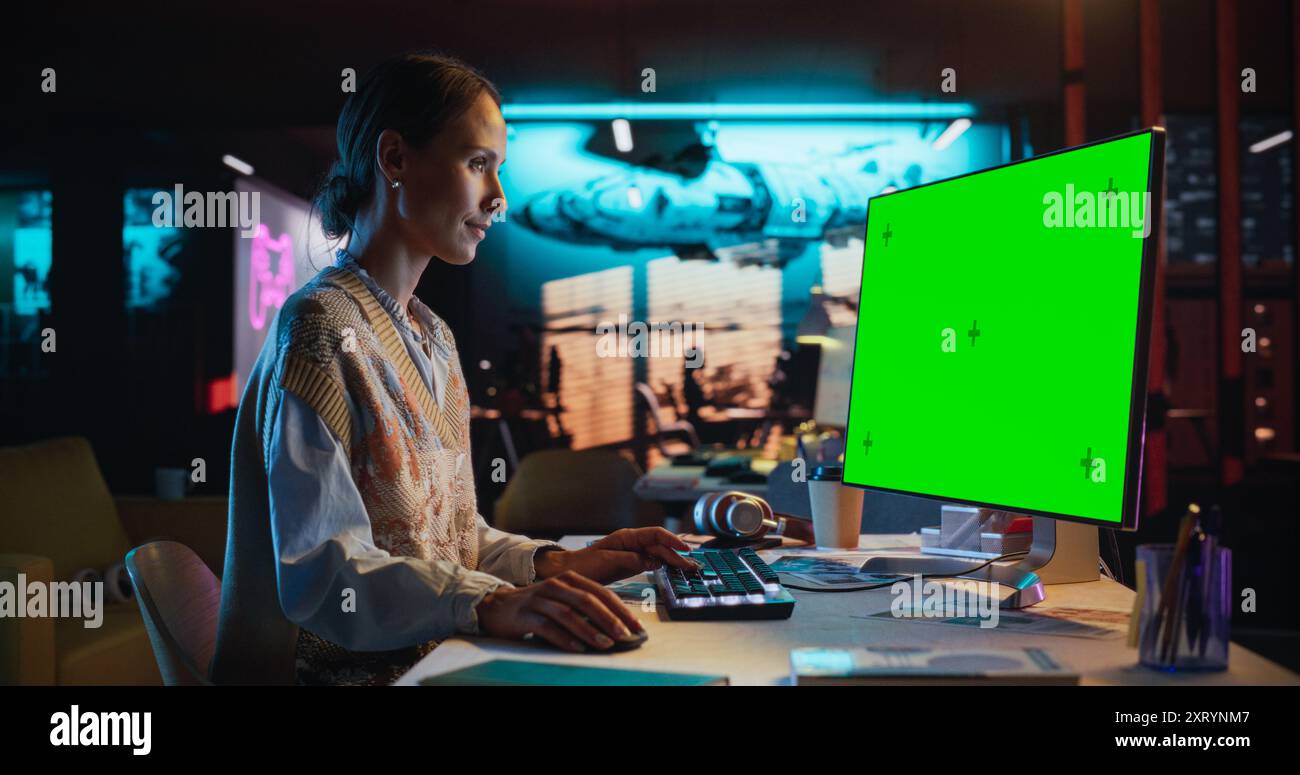 Portrait of Young Woman Sitting at Her Desk Using Desktop Computer with ...