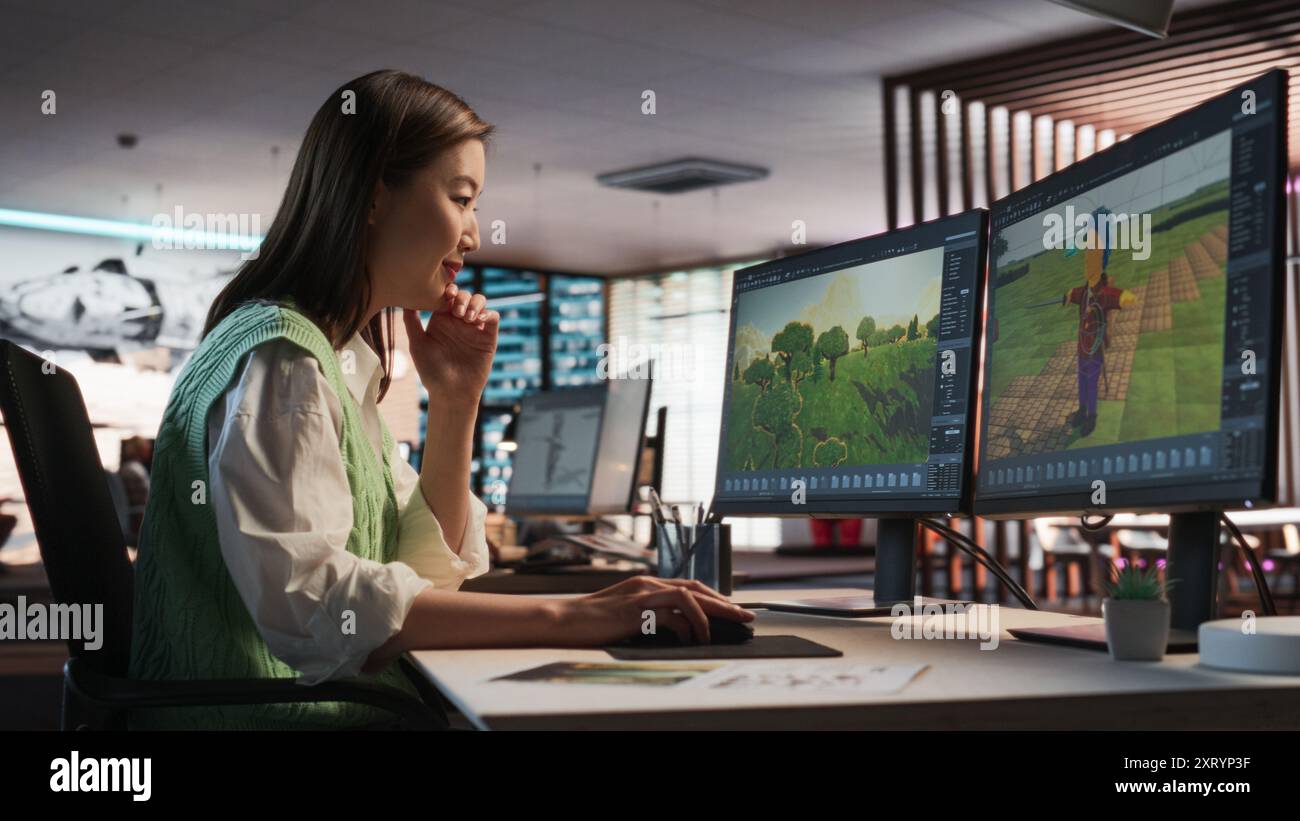 Female Asian Game Designer Using Desktop Computer, Designing Unique World And Characters In 3D ...