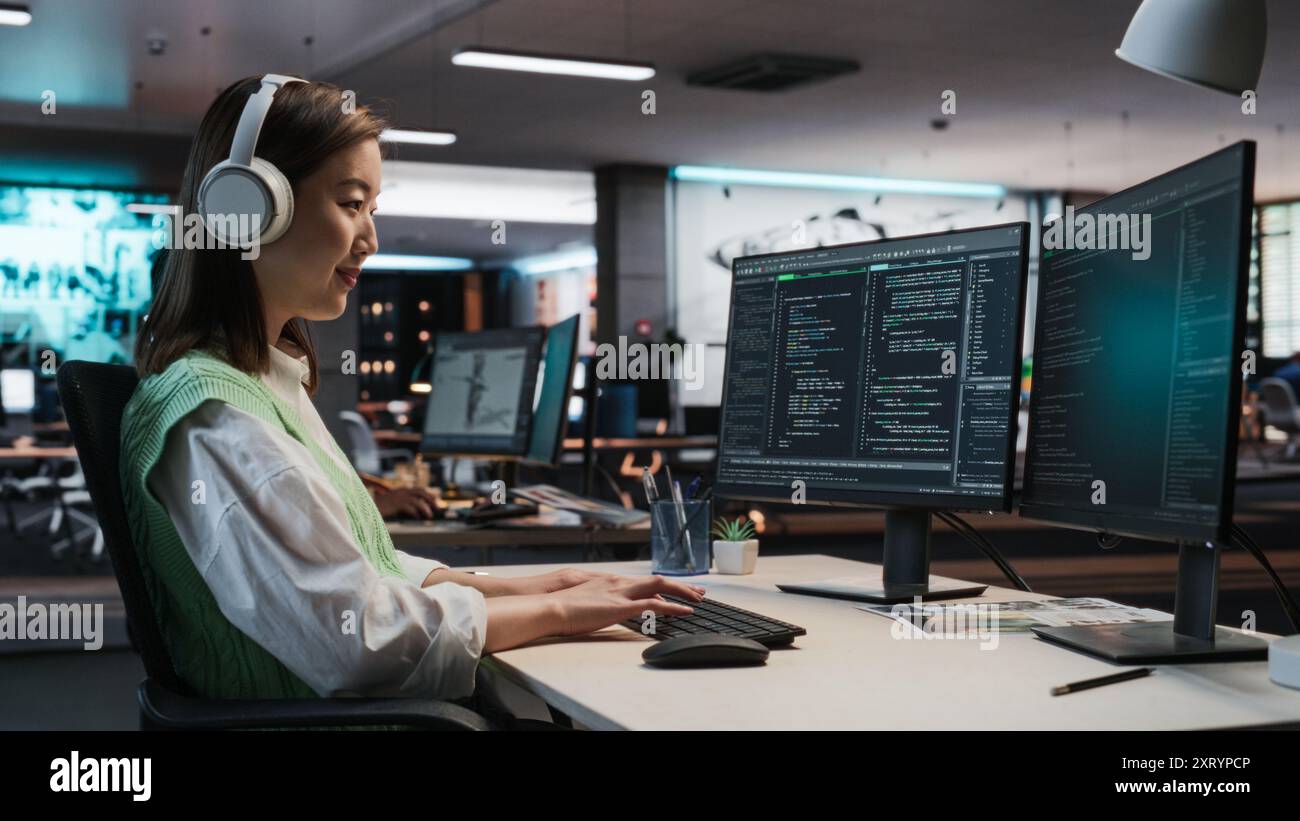 Female programmer writes code on hi-res stock photography and images ...