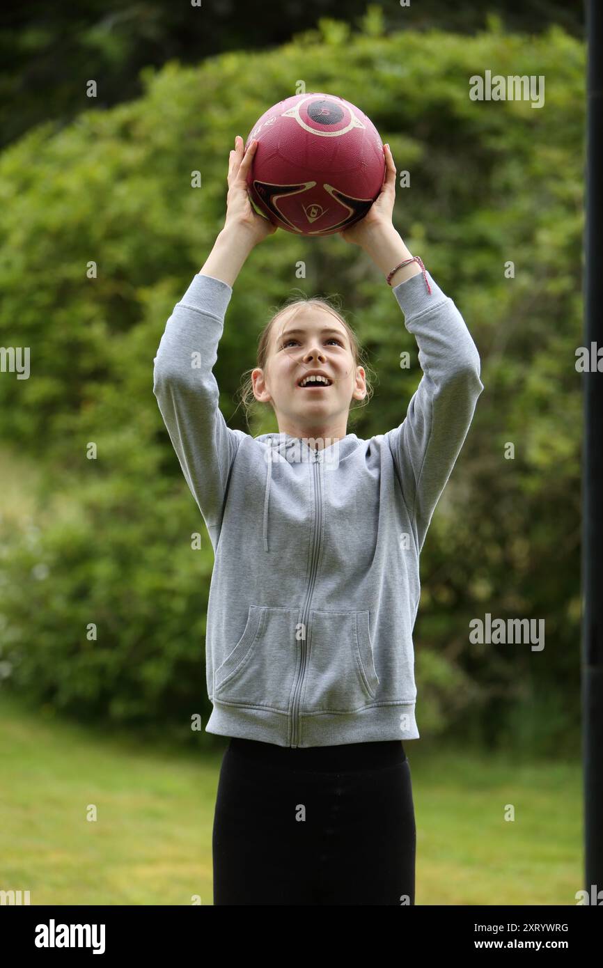 Girl playing netball practising shooting - sport aiming aim accuracy ...