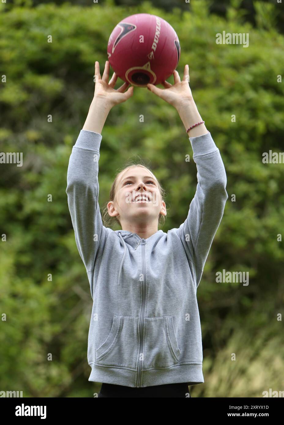 Girl playing netball practising shooting - sport aiming aim accuracy ...