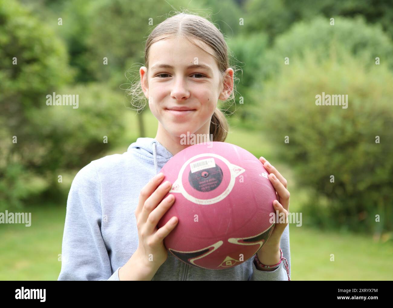 Girl playing netball holding netball smiling - sport exercise teenage ...