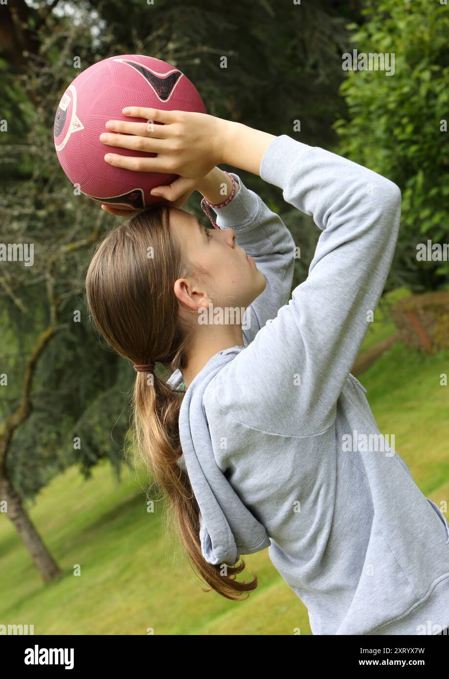 Girl playing netball practising shooting - sport aiming aim accuracy ...