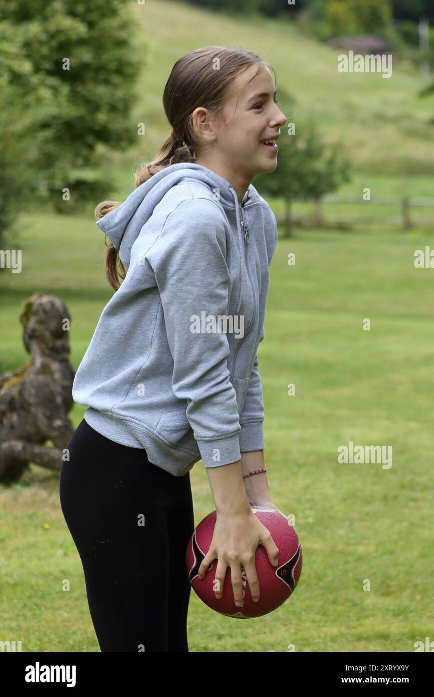Girl playing netball practising shooting - sport aiming aim accuracy ...