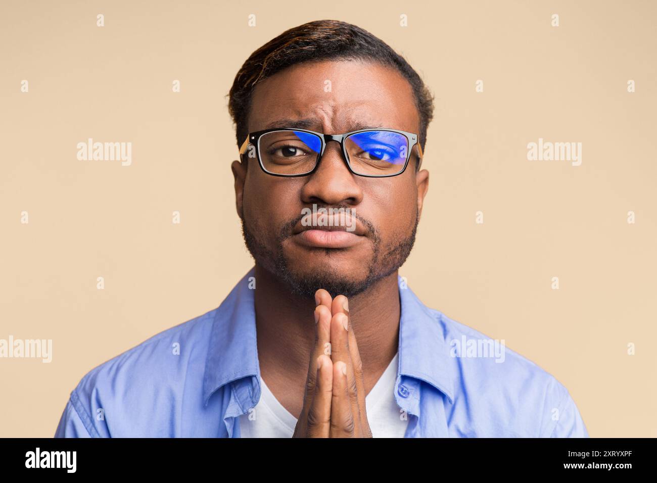 Portrait sad black man standing hi-res stock photography and images - Alamy