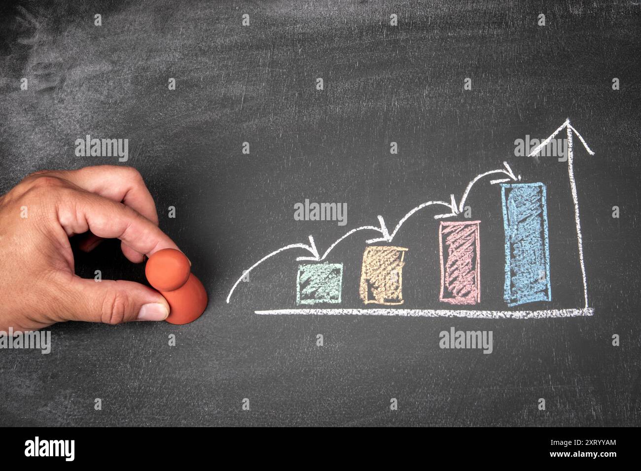 Salary increase and career ladder concept. Wooden human figures on a ...