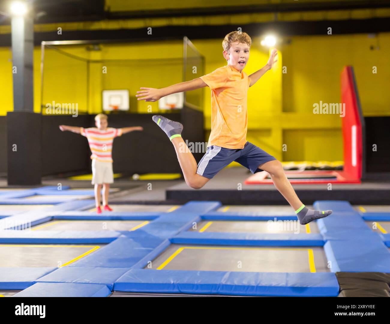 Boy jumping on trampoline park in sport center Stock Photo - Alamy