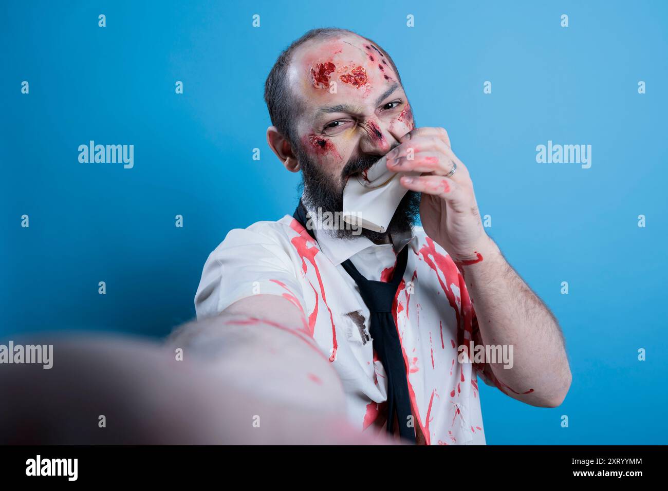 Furious man becoming lunatic after drinking too much coffee, biting ...
