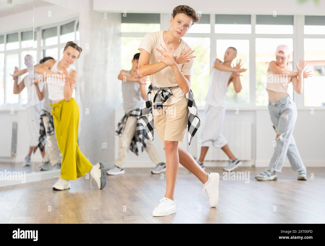 Teenage boy practicing basic hip hop moves in training hall Stock Photo ...