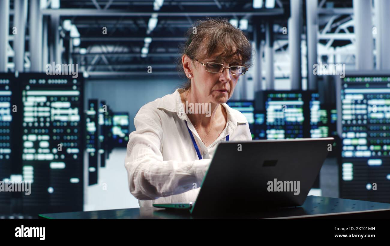 Trained mechanic working in high tech facility housing GPU dedicated ...