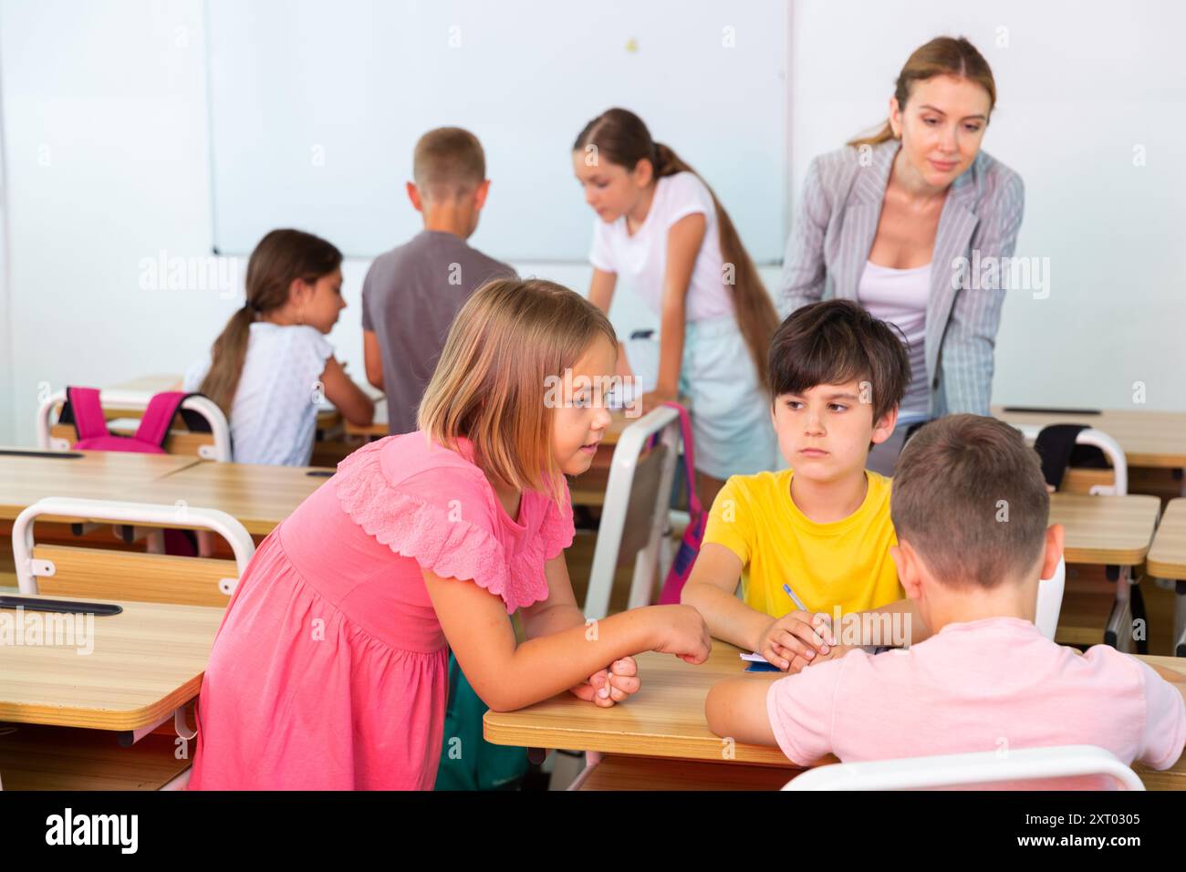 Tweens working in small groups during lesson at school Stock Photo - Alamy