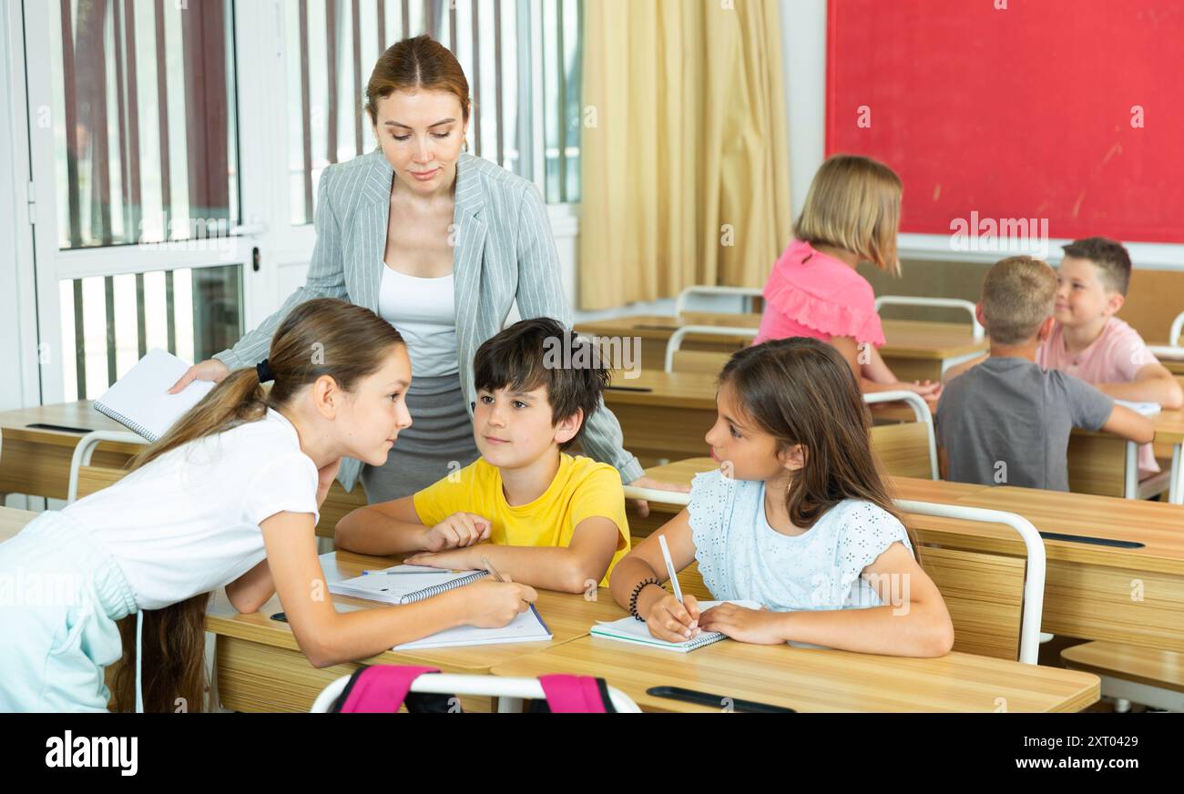 Kids doing group tasks Stock Photo - Alamy
