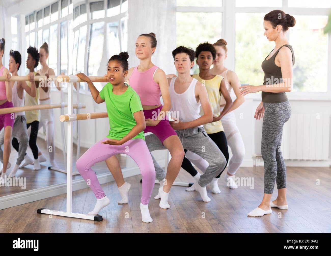 Woman teacher corrects movement hi-res stock photography and images - Alamy