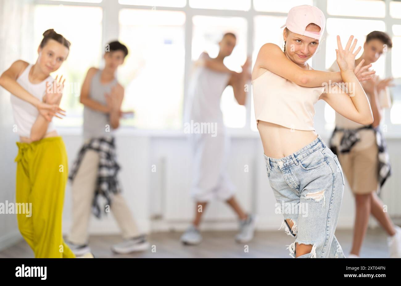 Teenage girl dancing jazz funk in group Stock Photo - Alamy
