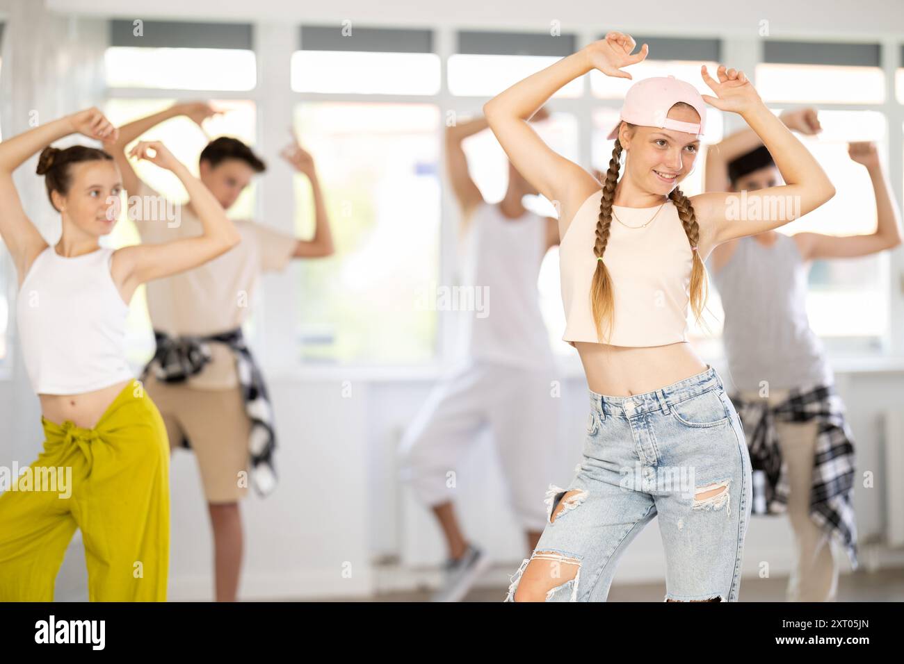 Teenage girl dancing jazz funk in group Stock Photo - Alamy