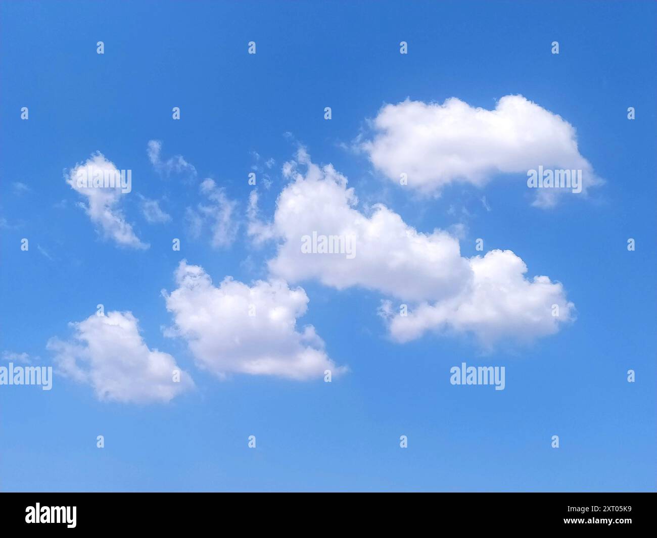 Peaceful blue sky with fluffy white clouds. Clear day: white clouds ...
