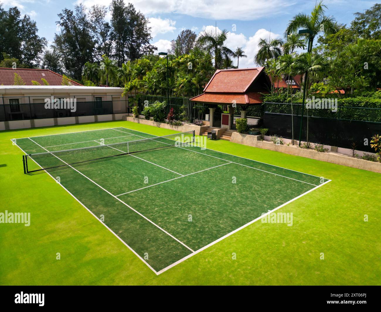 Phuket, Thailand - December 13, 2022: Outdoor grass tennis court at the ...