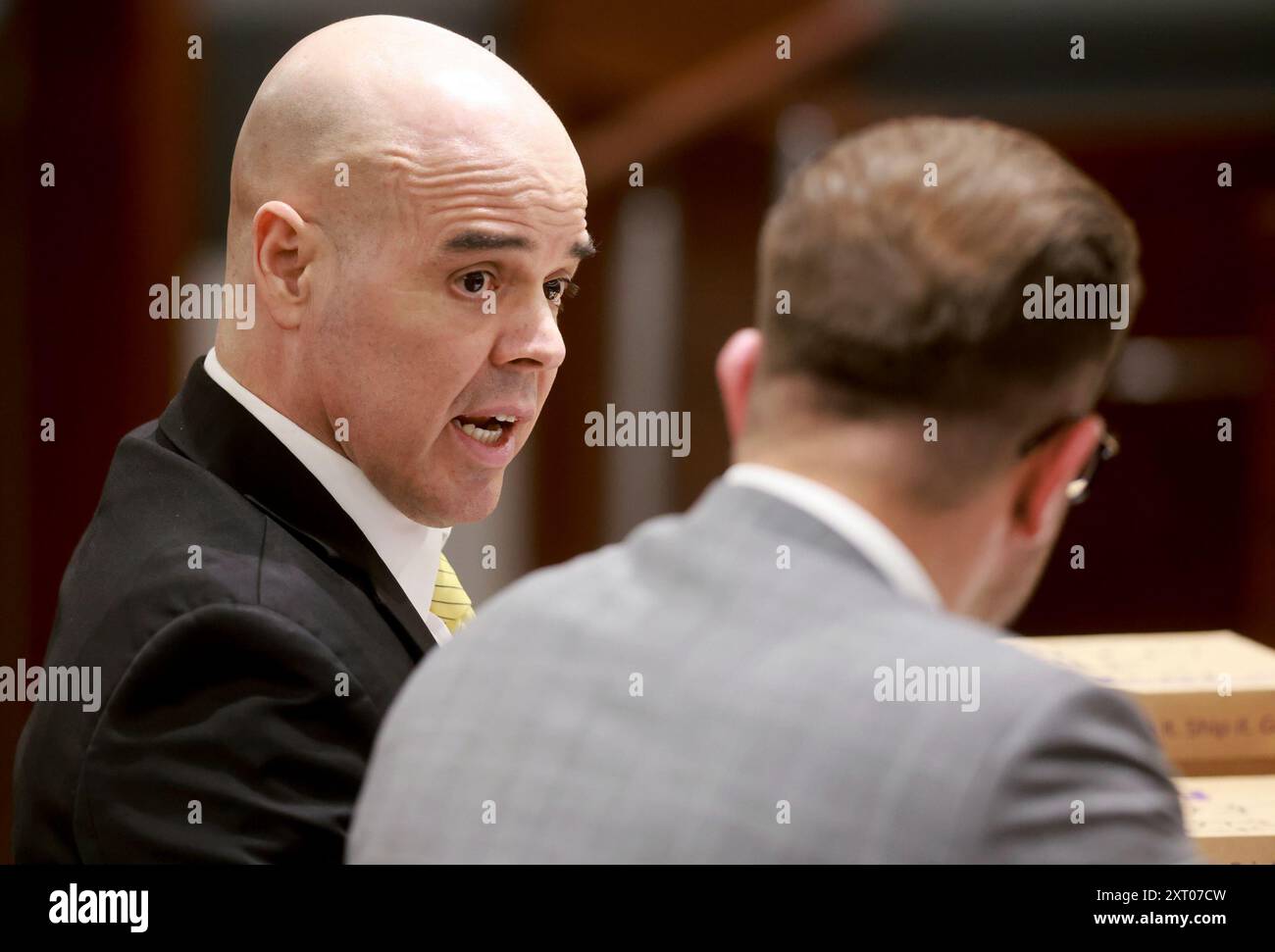 Robert Telles, left, speaks with attorney Michael Horvath on the first ...