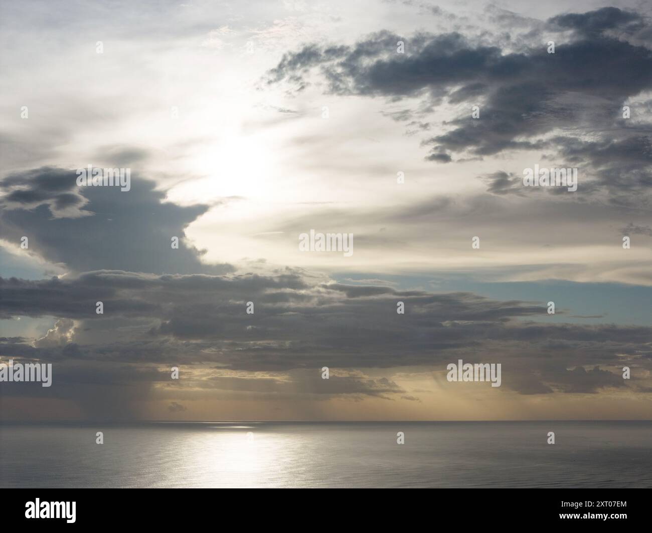 Ocean landscape with big fluffy clouds on golden sunset hour Stock ...