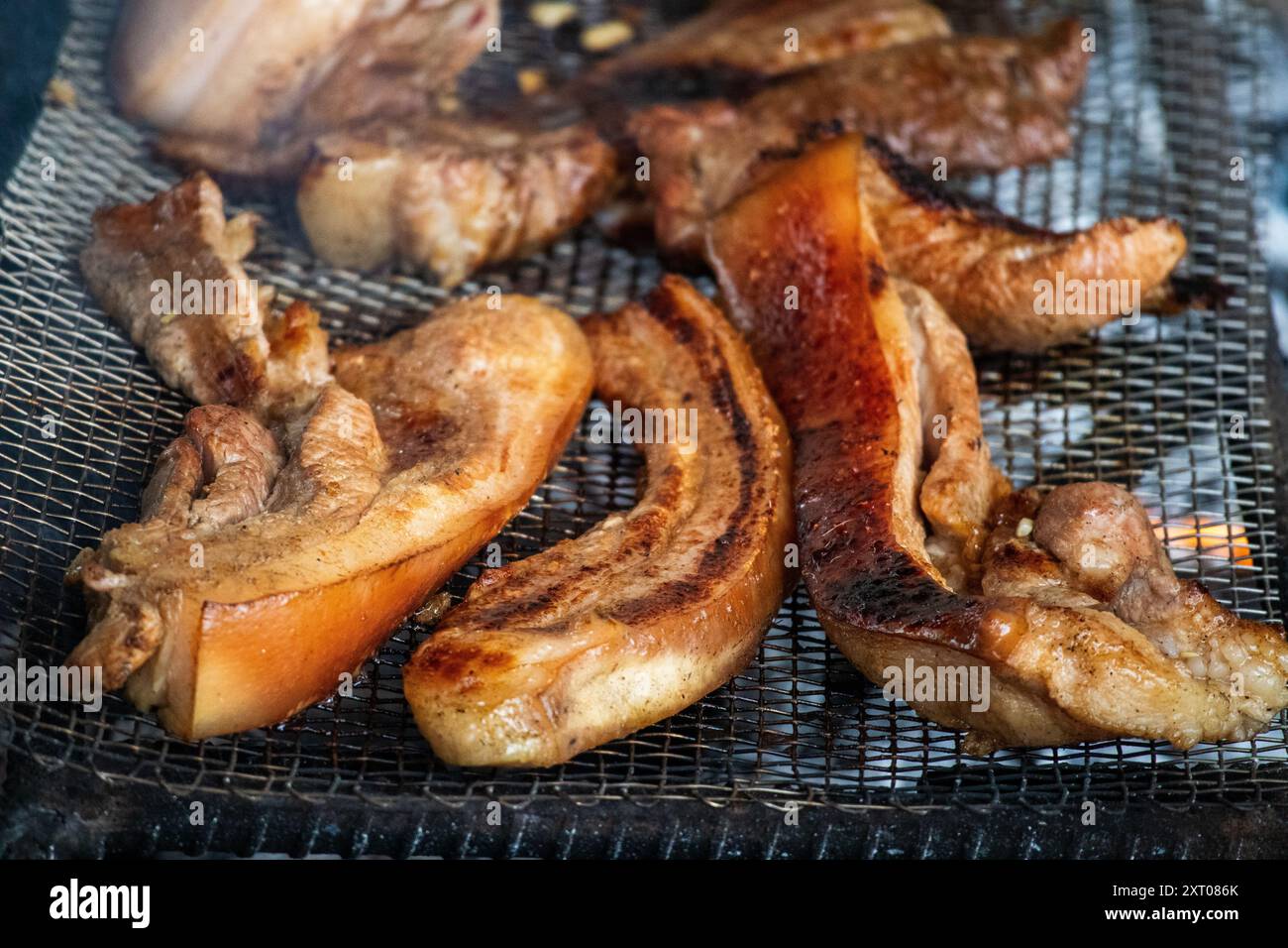 Lechon Pork Belly on a mesh grill in the Philippines outside of Cebu ...
