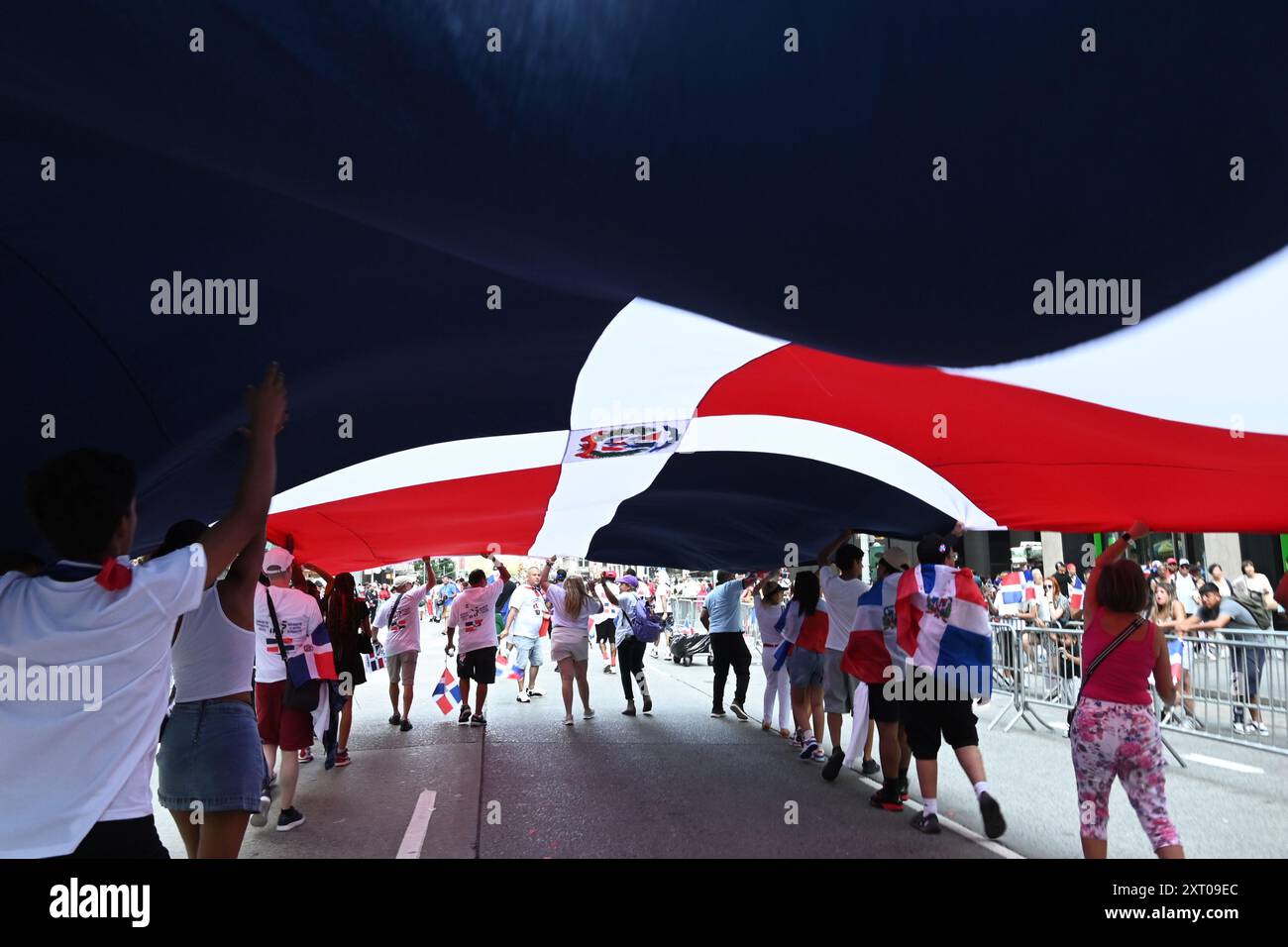 Large Dominican Flag carried by marcher at the Dominican Parade.8-11-24 ...