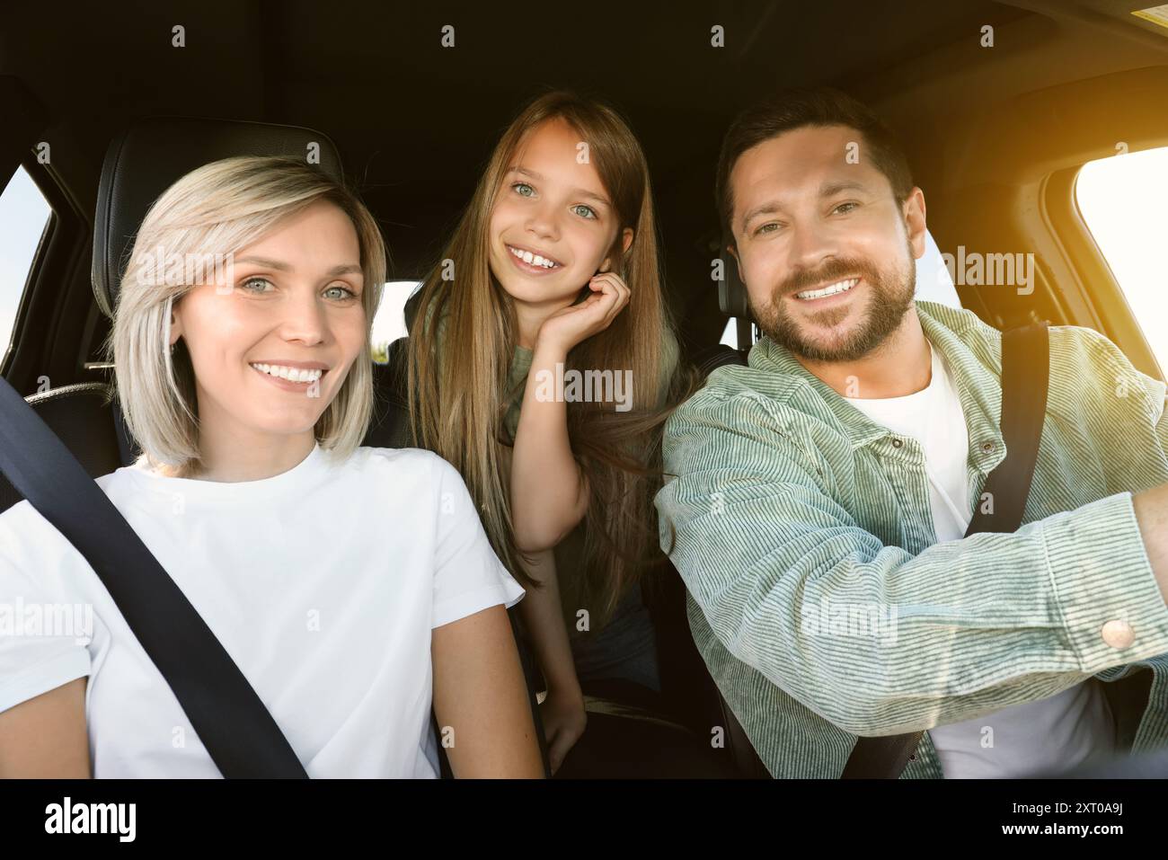 Happy family on road trip. Parents with daughter in car Stock Photo - Alamy